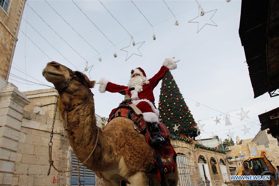 Man dressed as Santa Claus rides camel in Jerusalem's Old City - People ...