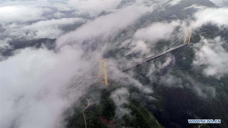 Bridge enveloped by clouds and fog in Enshi, central China's Hubei ...