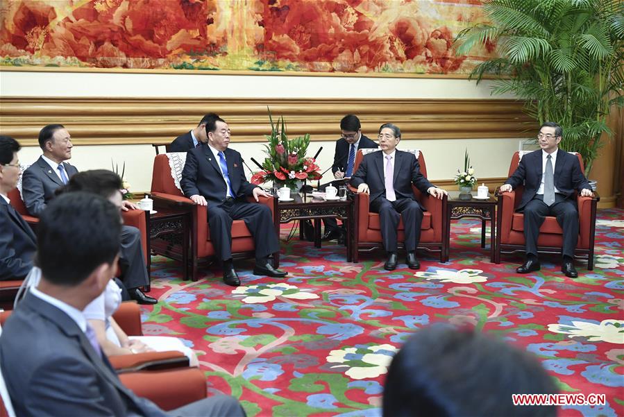 Senior CPC official meets DPRK Central Court president - People's Daily ...